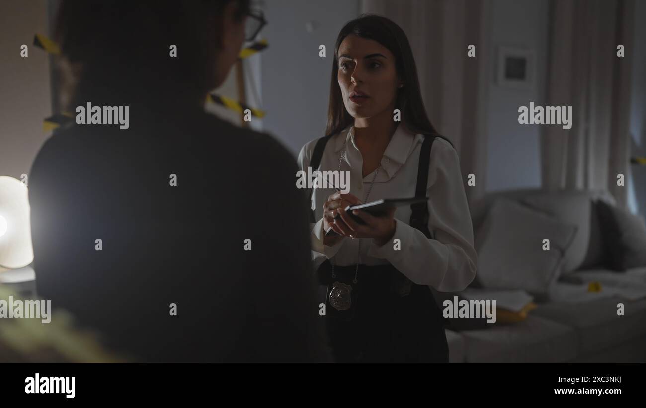 Two women detectives investigating a dimly lit indoor crime scene with ...