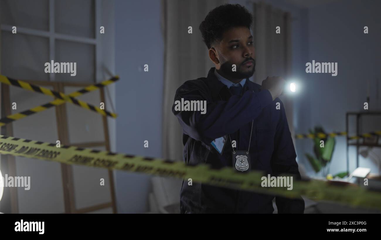 An african american man inspects a crime scene indoors, illuminated by ...
