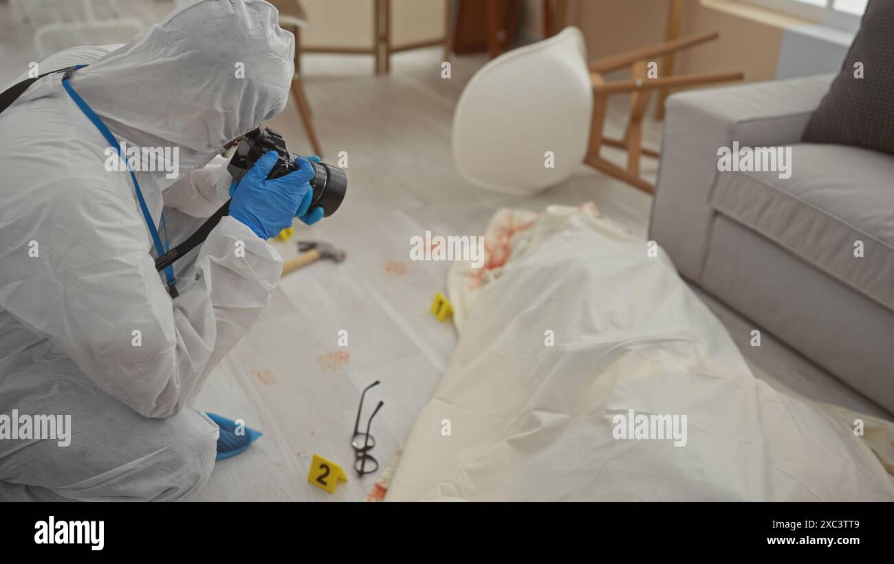 A man in protective forensic gear photographs evidence at a house crime ...