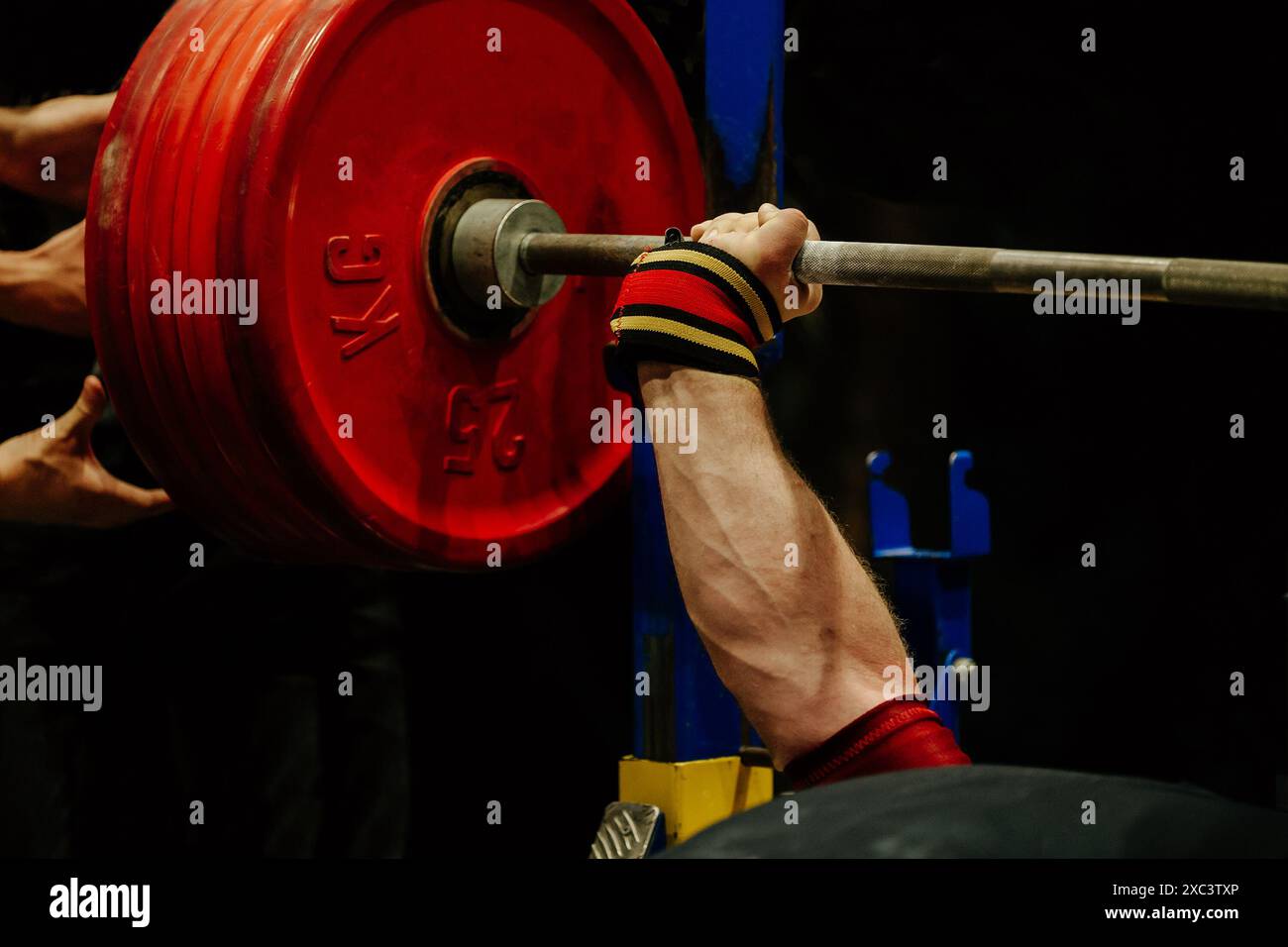 athlete arm in wristband holds barbell in bench press Stock Photo - Alamy