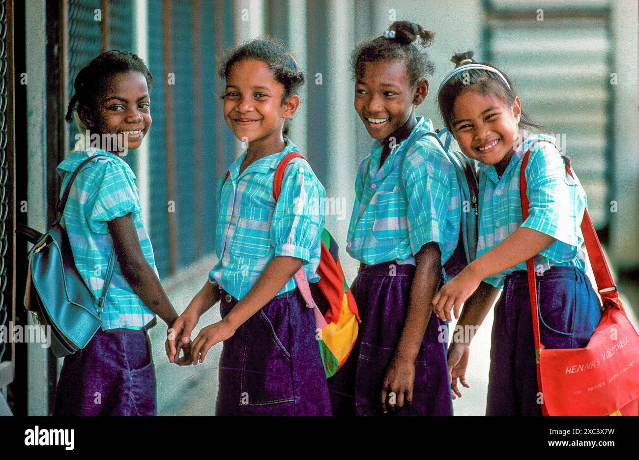 Suriname, Paramaribo. Schoolgirls wearing their school uniforms in a ...