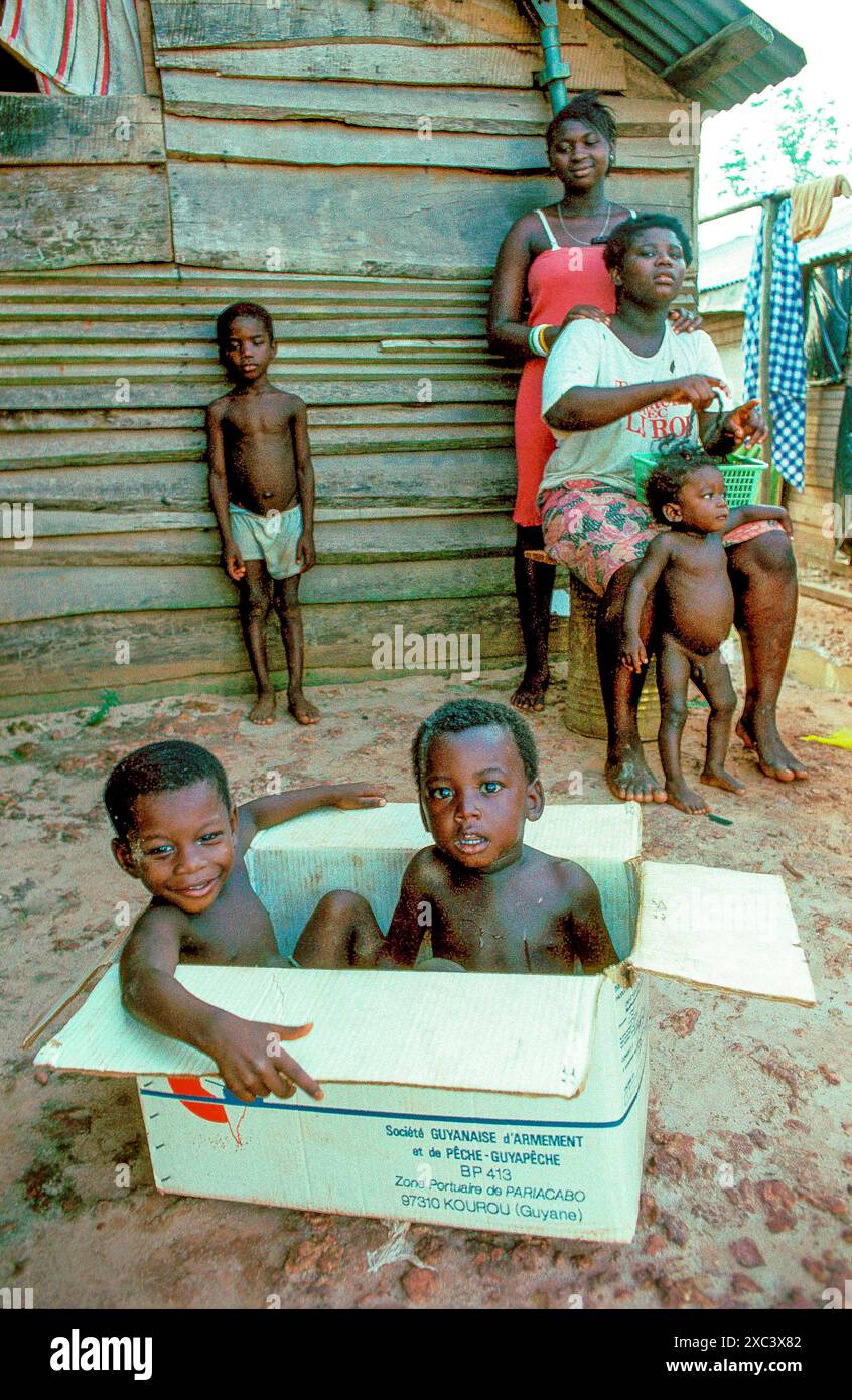 Suriname, Drietabbetje. Displaced Maroon family in a village near the ...