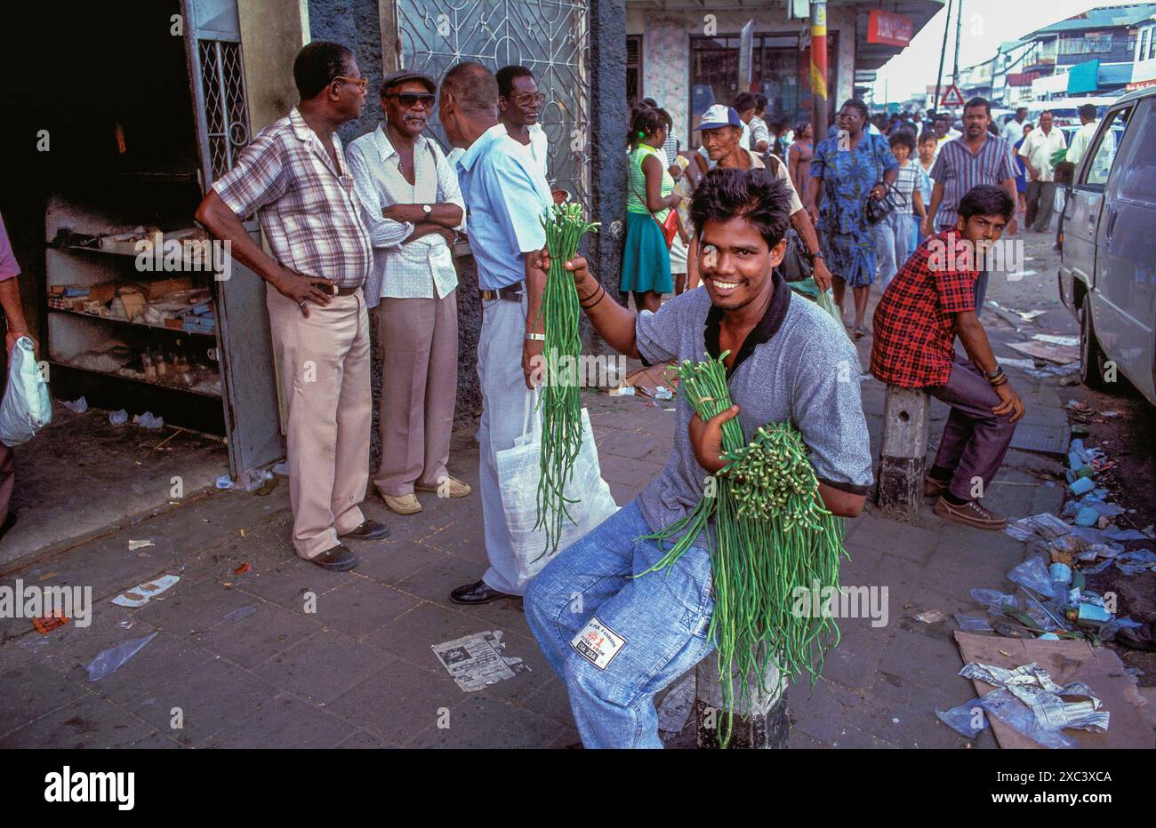Suriname - Man sells vegetables called "Kouseband" in the street of ...