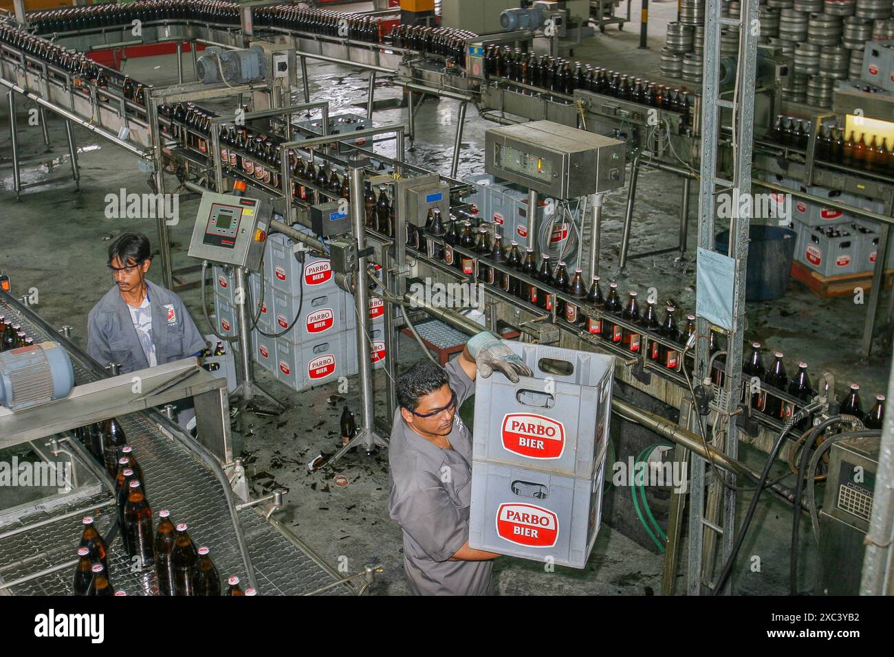 Suriname, Paramaribo - Factory workers of the Parbo beer brewery, a ...