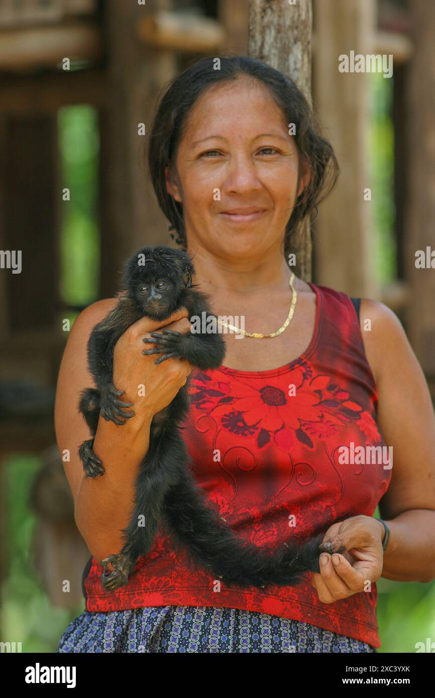 Suriname, Tepu. Portrait of a mother and child of the Trio tribe with a ...