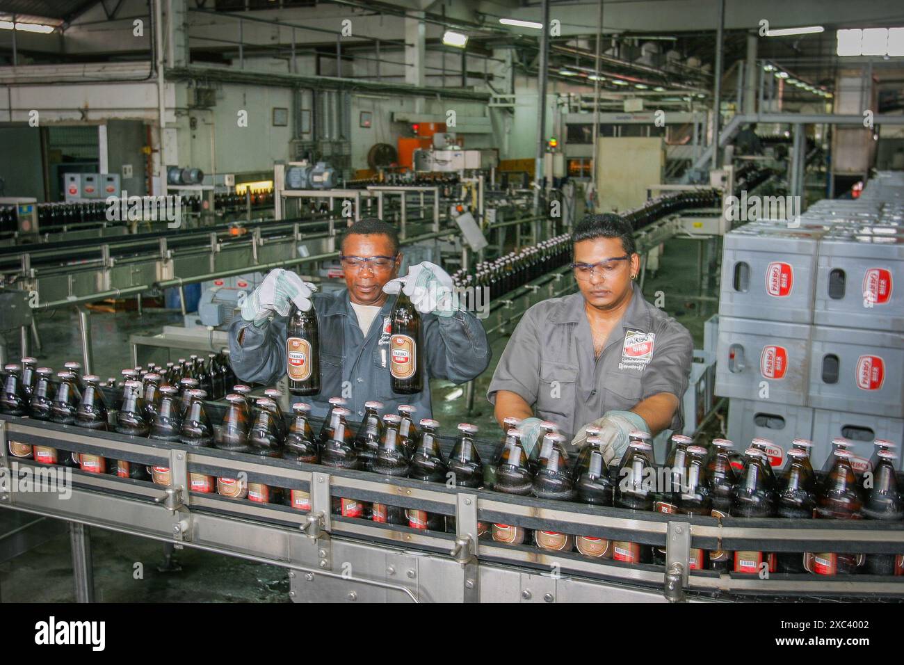 Suriname, Paramaribo - Factory workers of the Parbo beer brewery, a ...