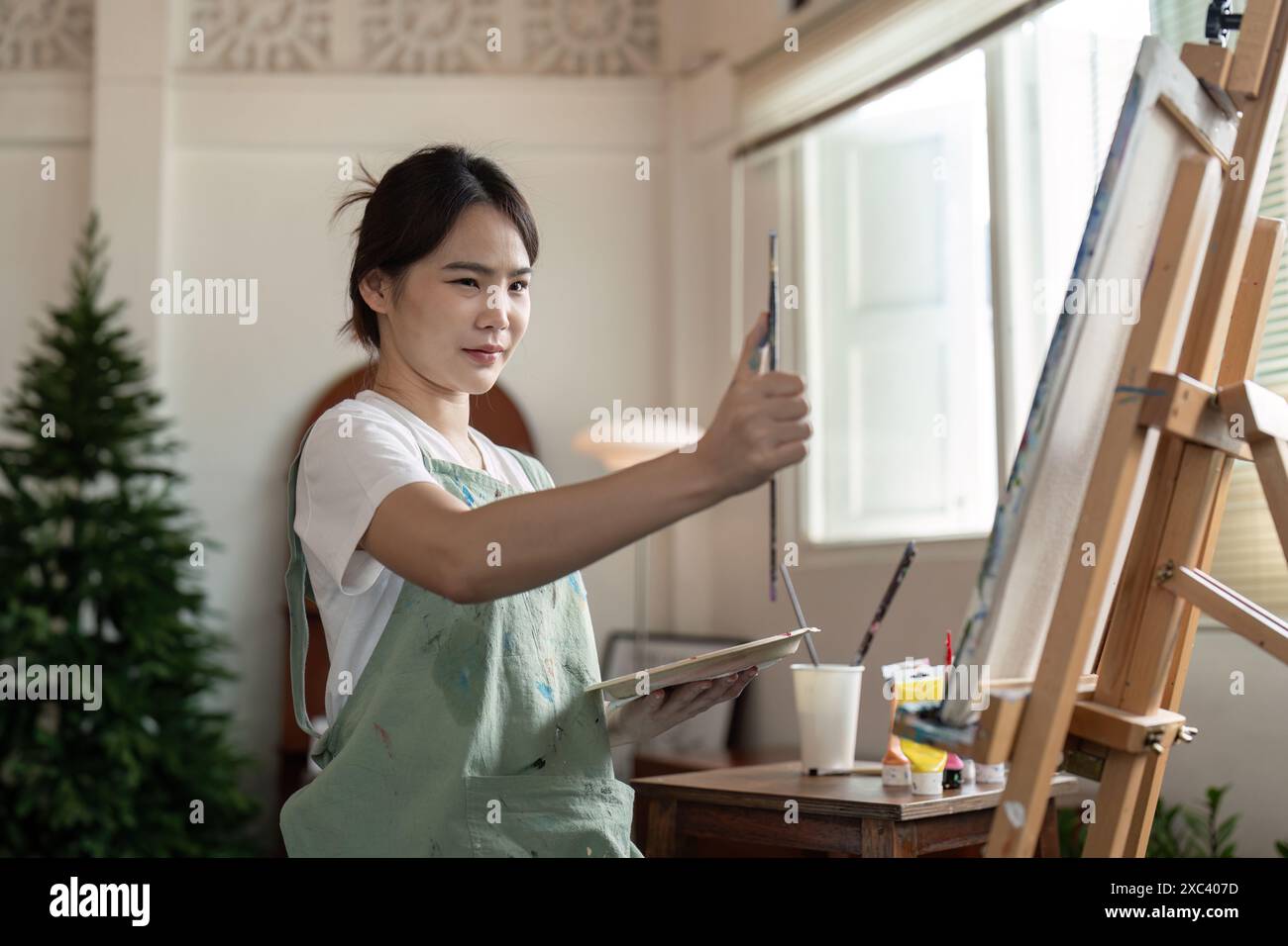 Focused talented female painter hi-res stock photography and images - Alamy