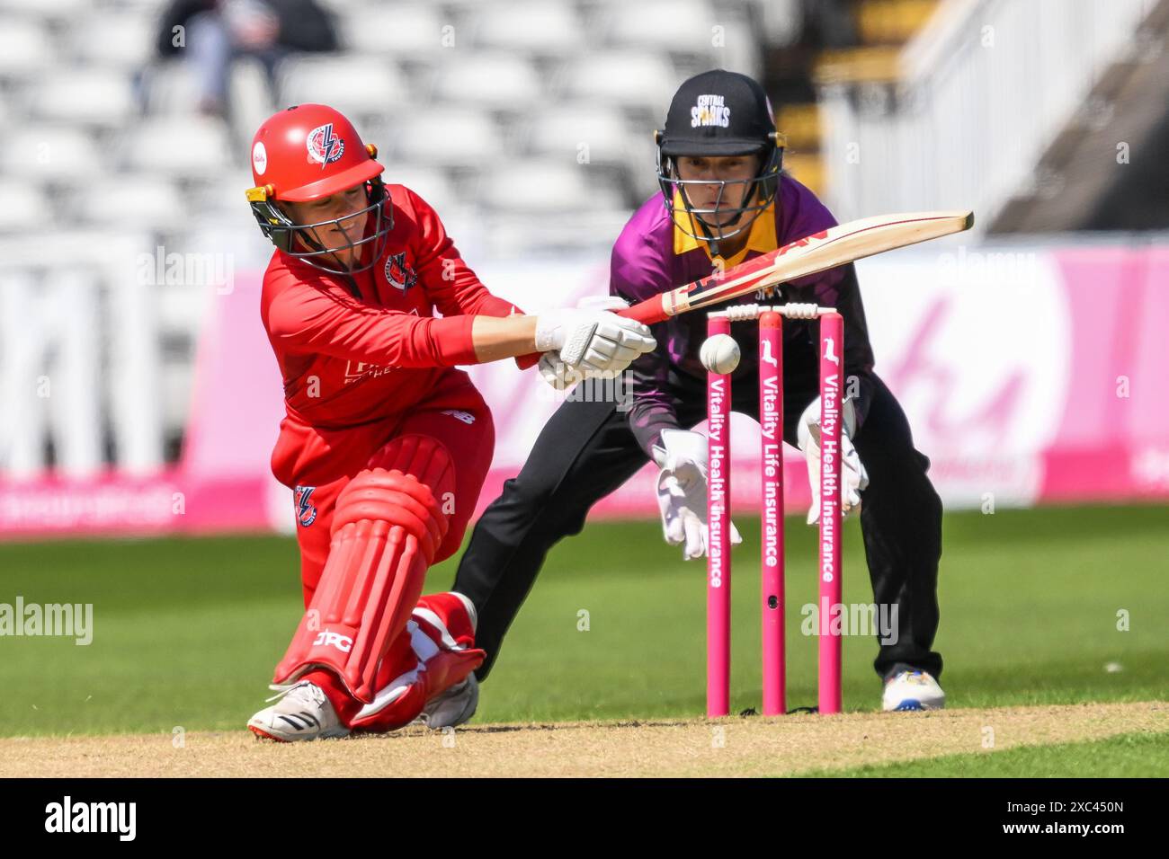 Katie Mack of Lancashire Thunder is bowled by Charis Pavely of Central ...