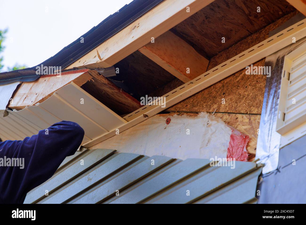 Ceiling house vinyl soffit plastic boards are mounted to roof rafters ...