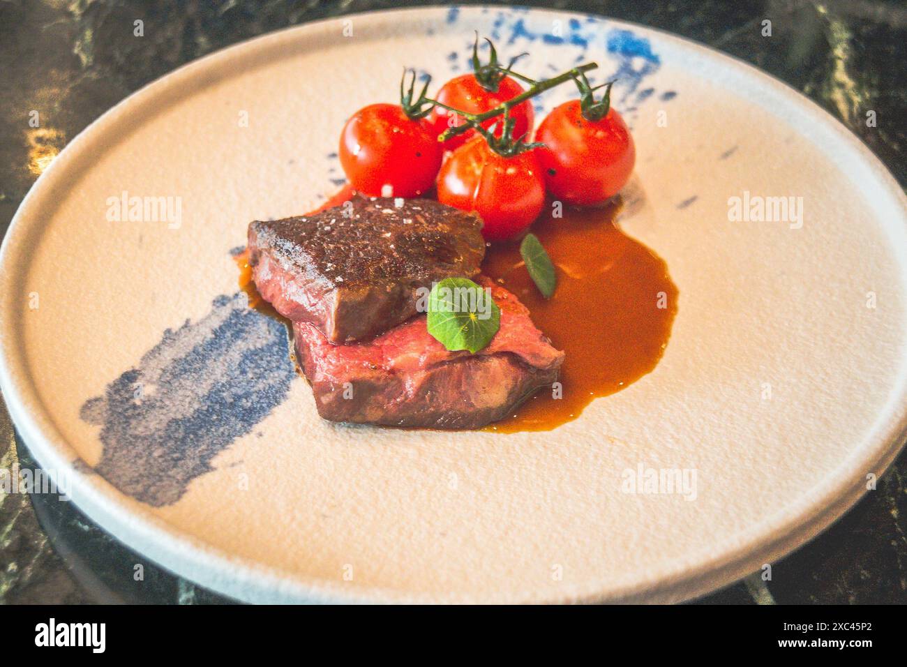 Wagyu Tri-tip made from 2GR Wagyu Tri-tip, red wine jus, baby tomatoes ...