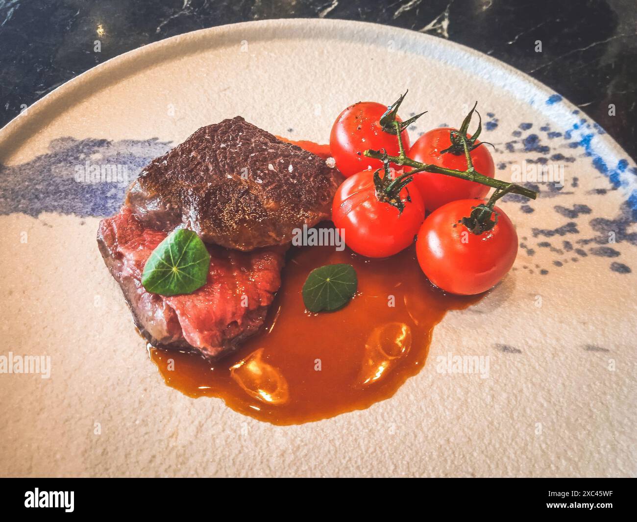 Wagyu Tri-tip made from 2GR Wagyu Tri-tip, red wine jus, baby tomatoes ...