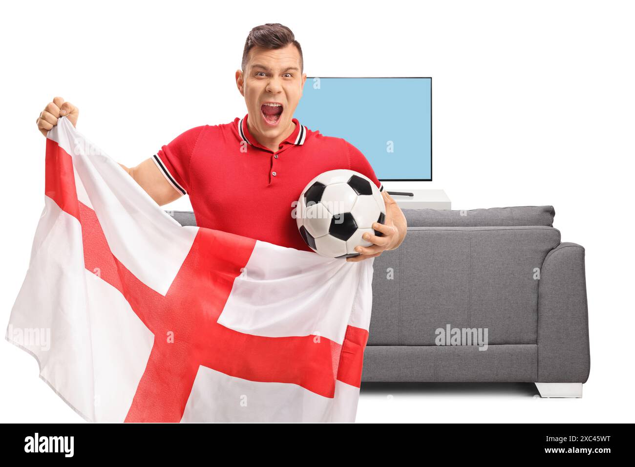 Excited soccer fan holding a football and an English flag in front of a ...