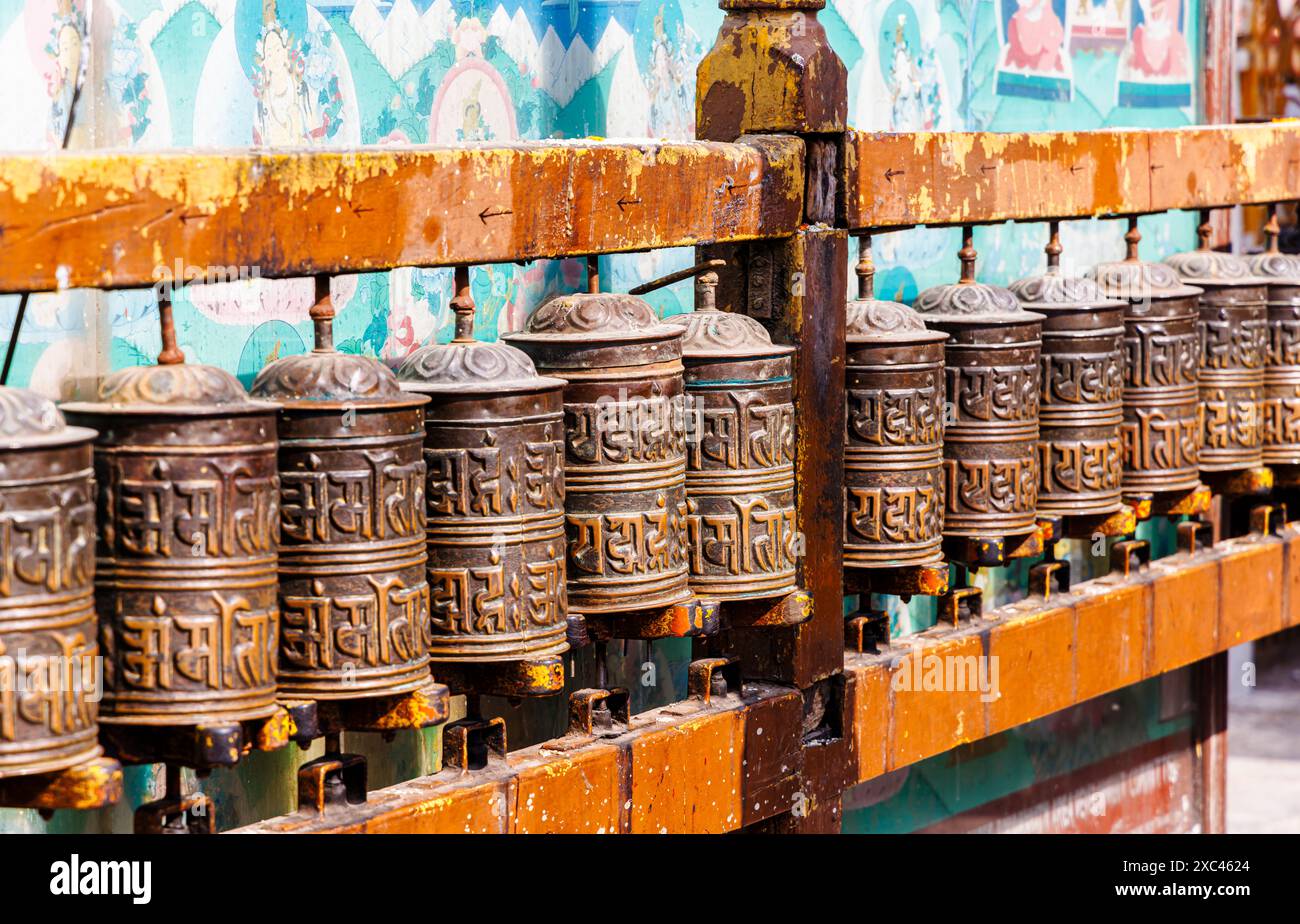 Traditional Buddhist wooden prayer wheels at the iconic Boudhanath ...