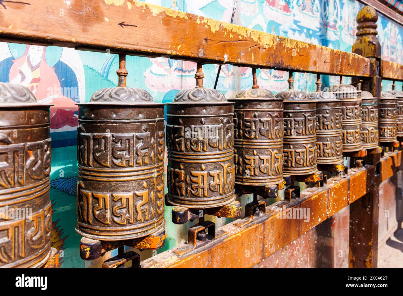 Traditional Buddhist wooden prayer wheels at the iconic Boudhanath ...