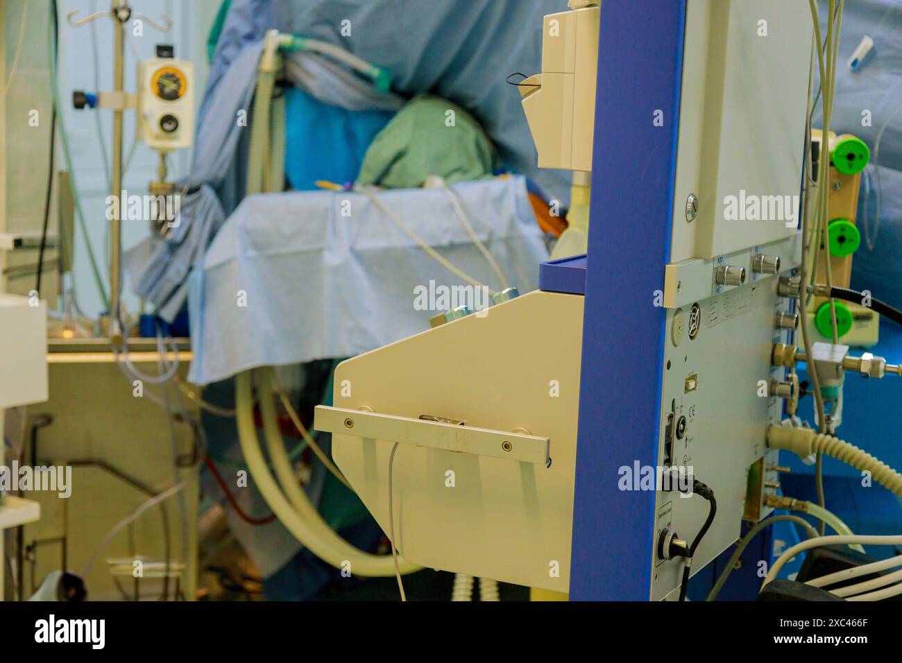 An operating room is being used by physician to perform surgery on ...