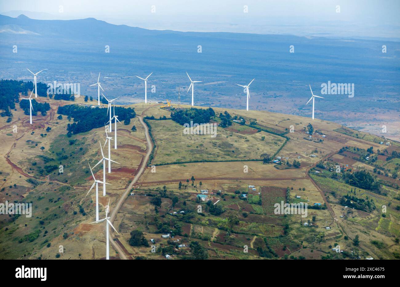 Aerial view of landscape on the Masai Mara, Kenya with wind turbine ...