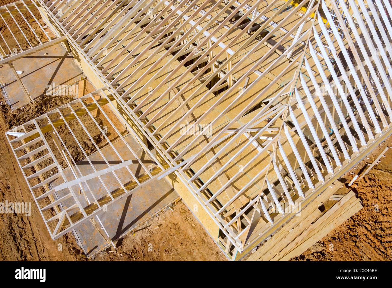 Building construction, is wooden beams framing new home under ...