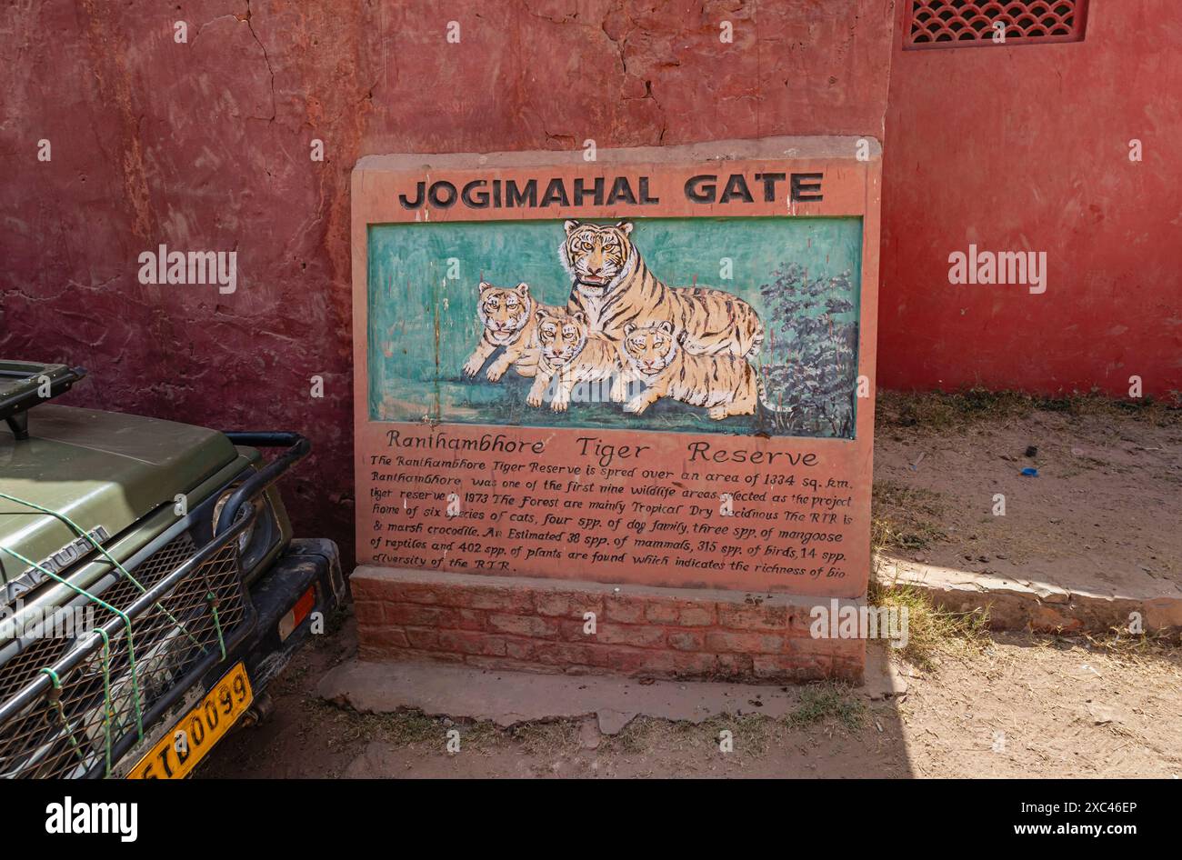 Sign with a painted picture of a family of tigers at the Jogimahal Gate ...