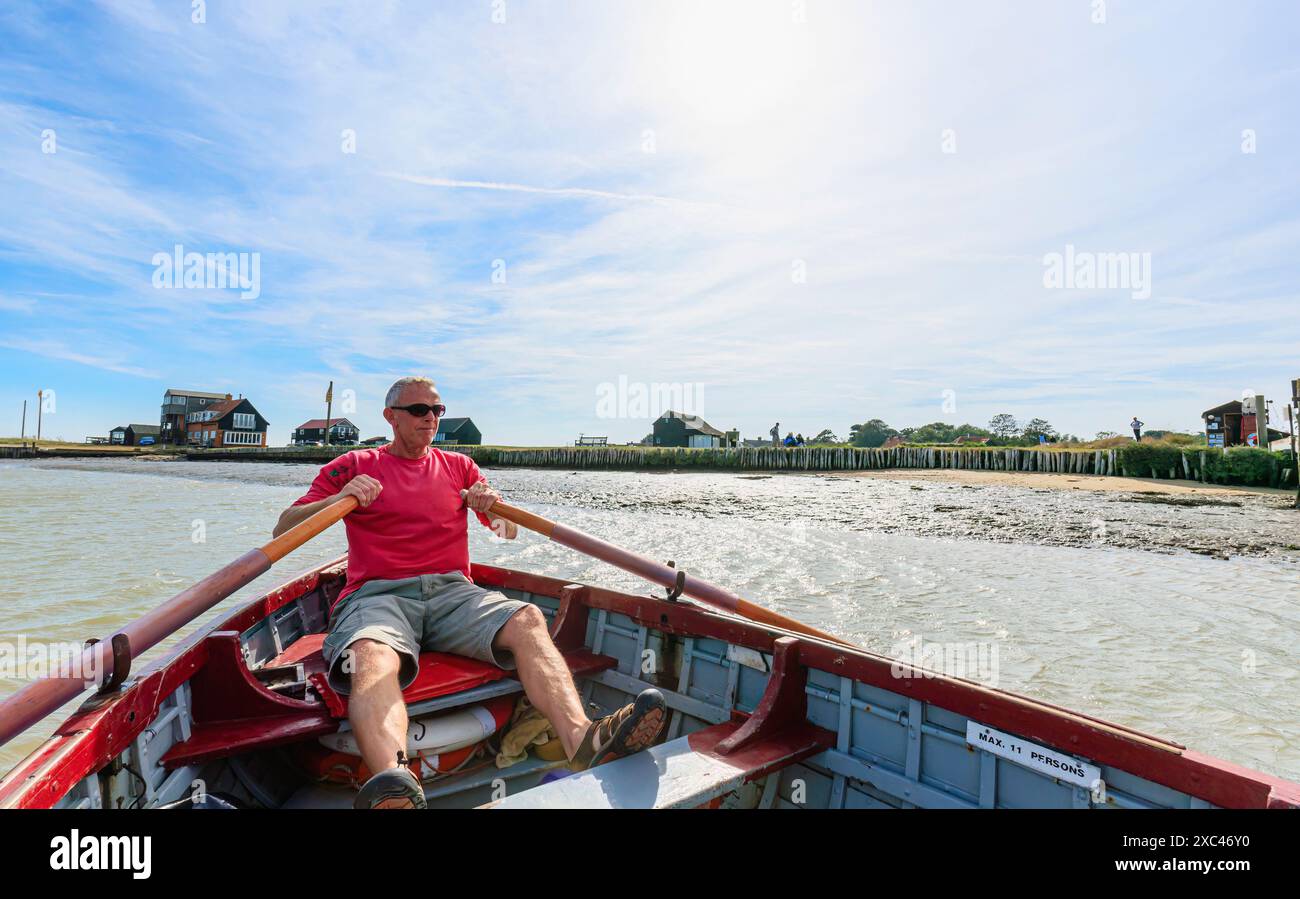 Ferryman on the rowing boat ferry crossing the River Blyth from ...