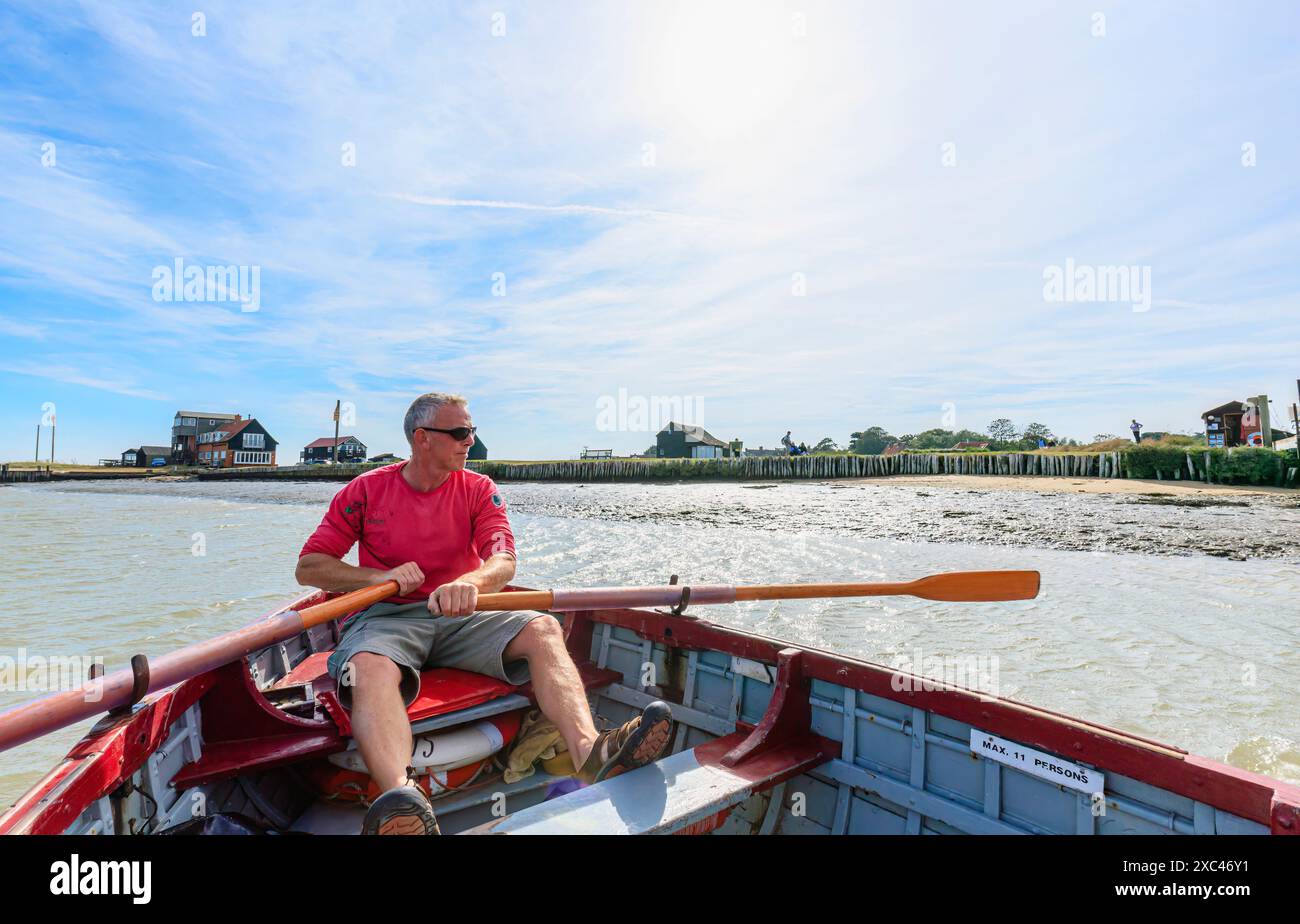 Ferryman on the rowing boat ferry crossing the River Blyth from ...