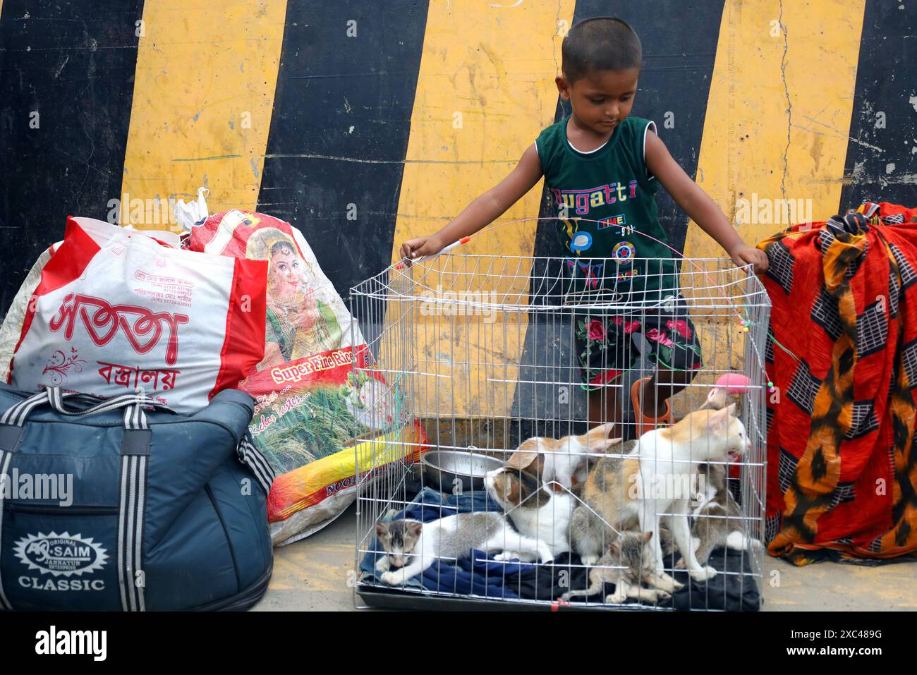 Dhaka, Dhaka, Bangladesh. 14th June, 2024. A family at Saidabad bus ...