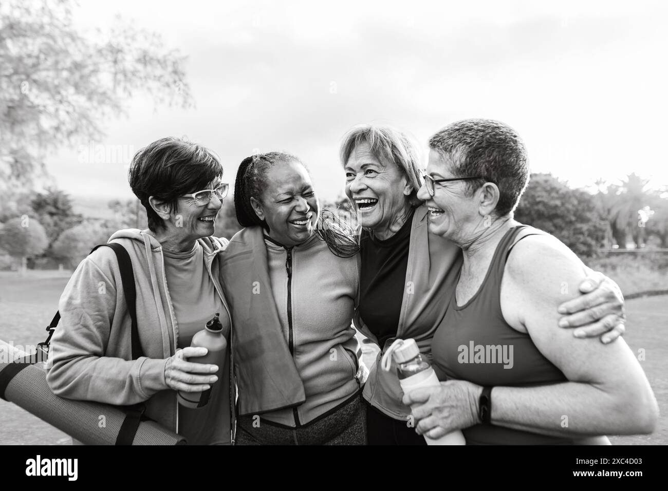 Happy multiracial senior women having fun after workout exercises in ...
