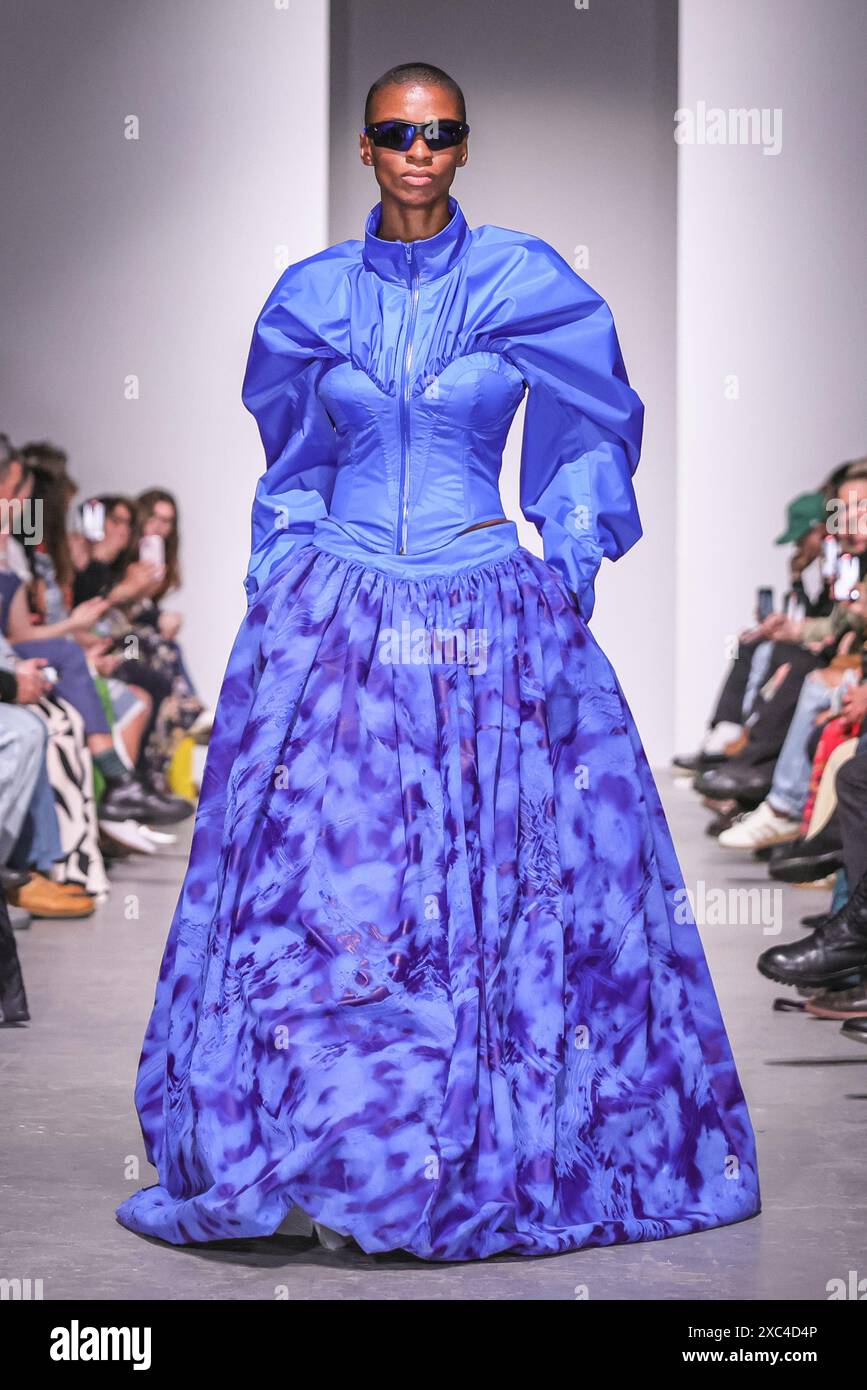 London, UK. 14th June, 2024. Models on the runway present the designs ...