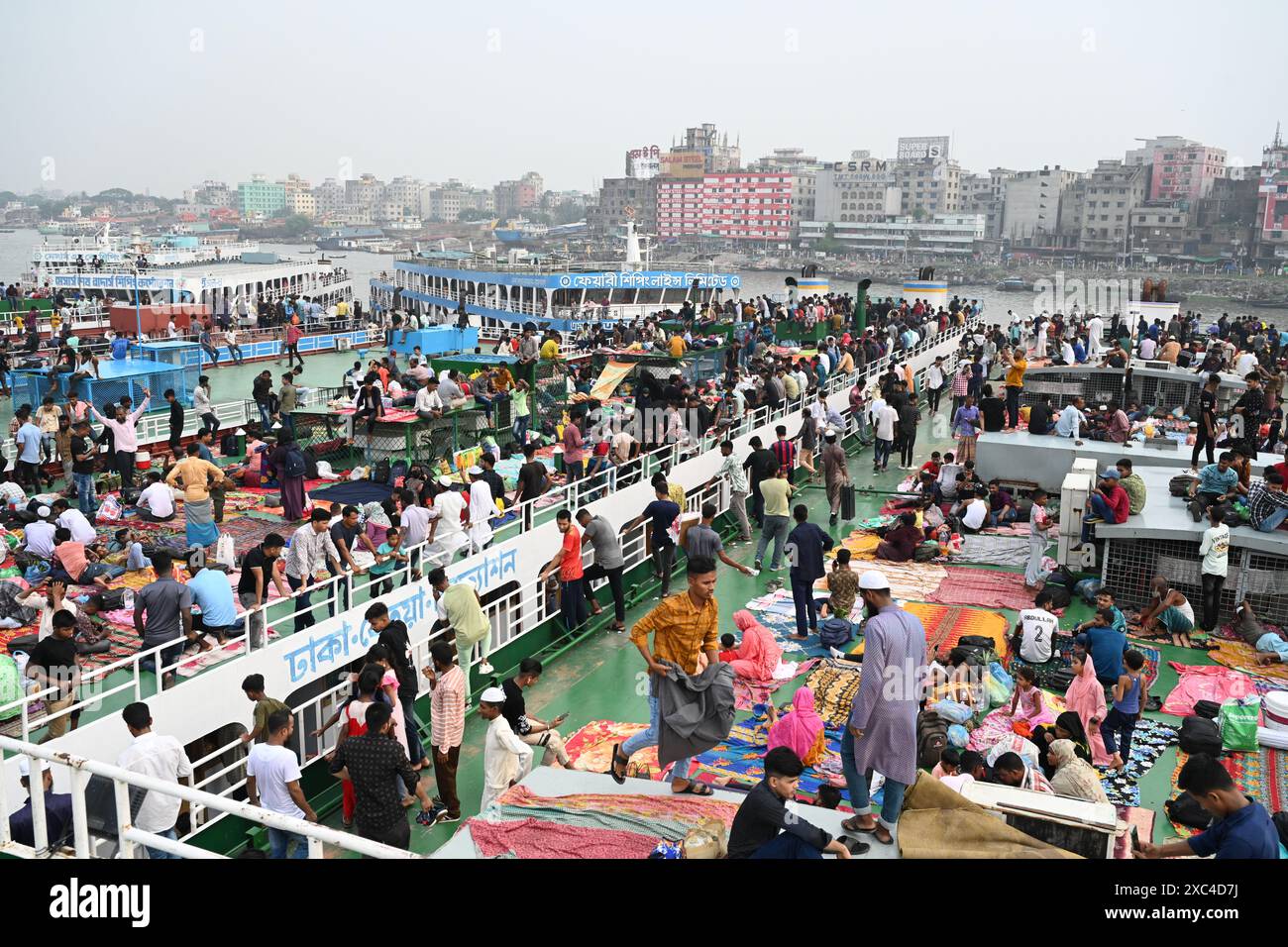 Passengers gather at the launch terminal for ferries as they travel ...