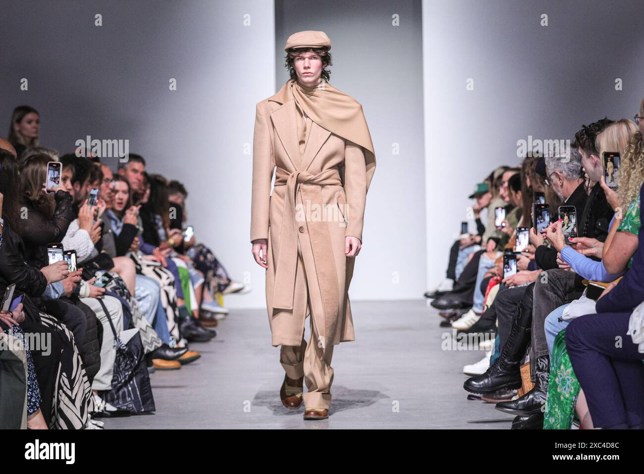 London, UK. 14th June, 2024. Models on the runway present the designs ...