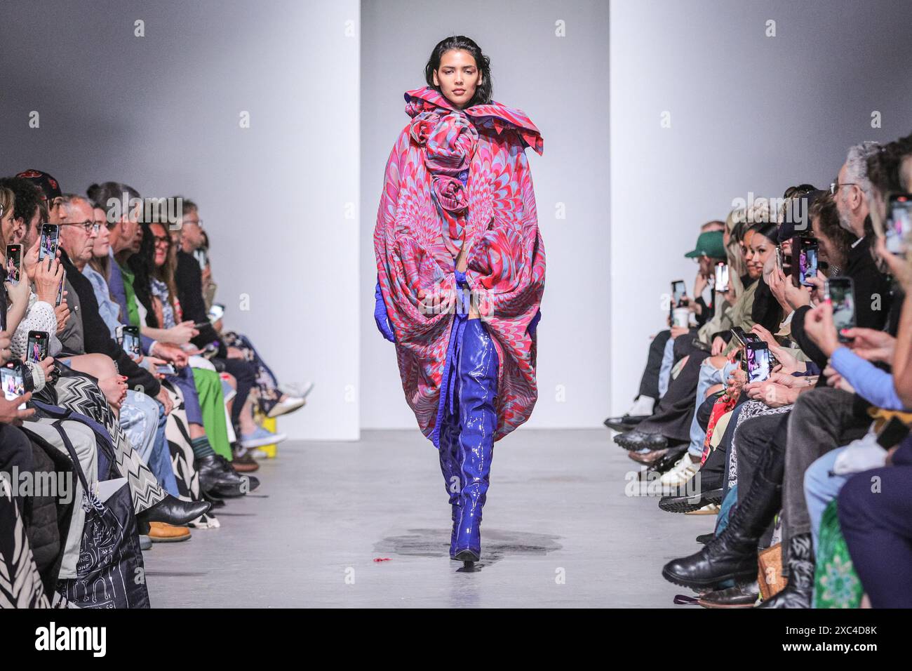 London, UK. 14th June, 2024. Models on the runway present the designs ...