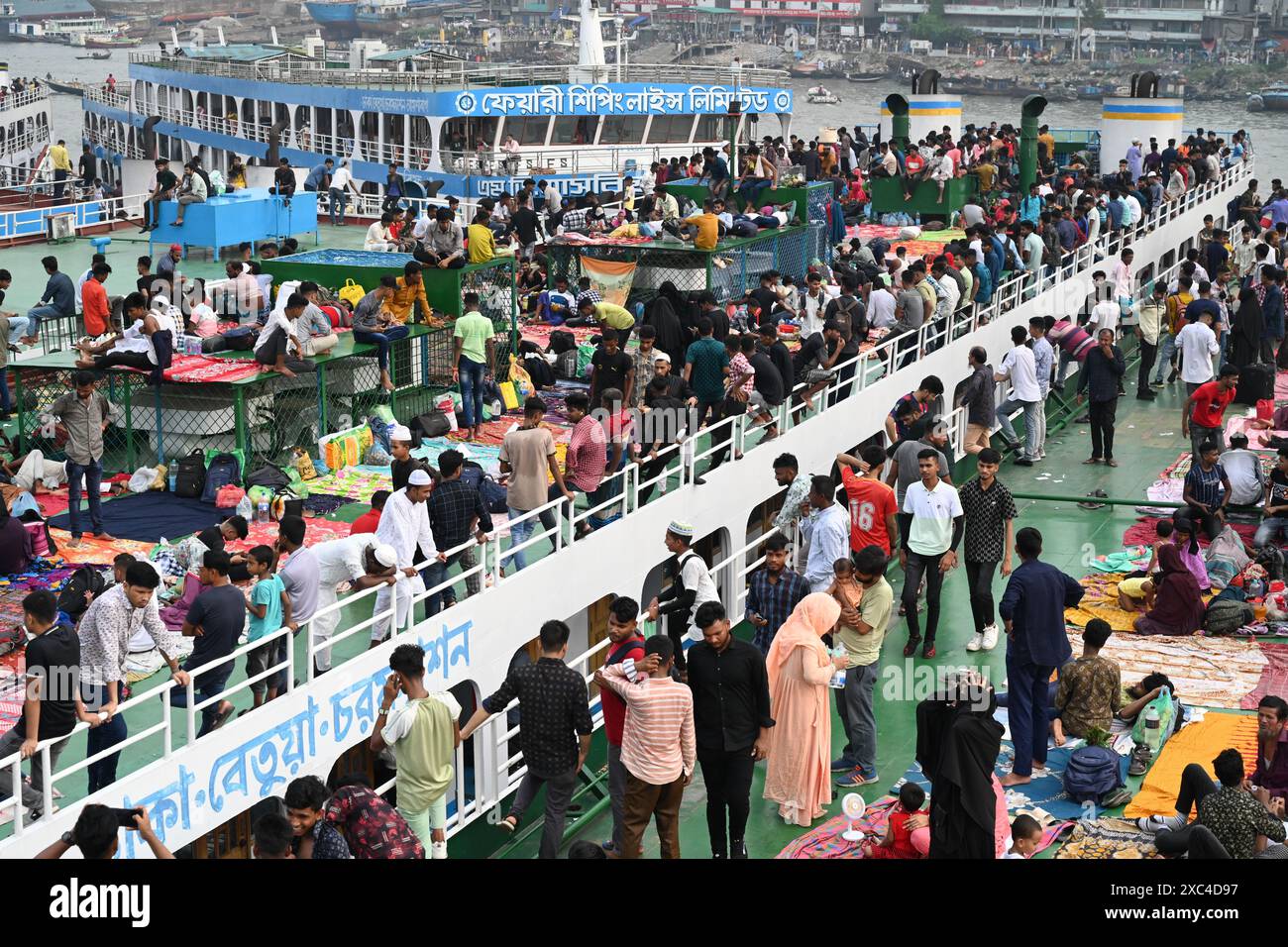 Passengers gather at the launch terminal for ferries as they travel back to their villages from ...