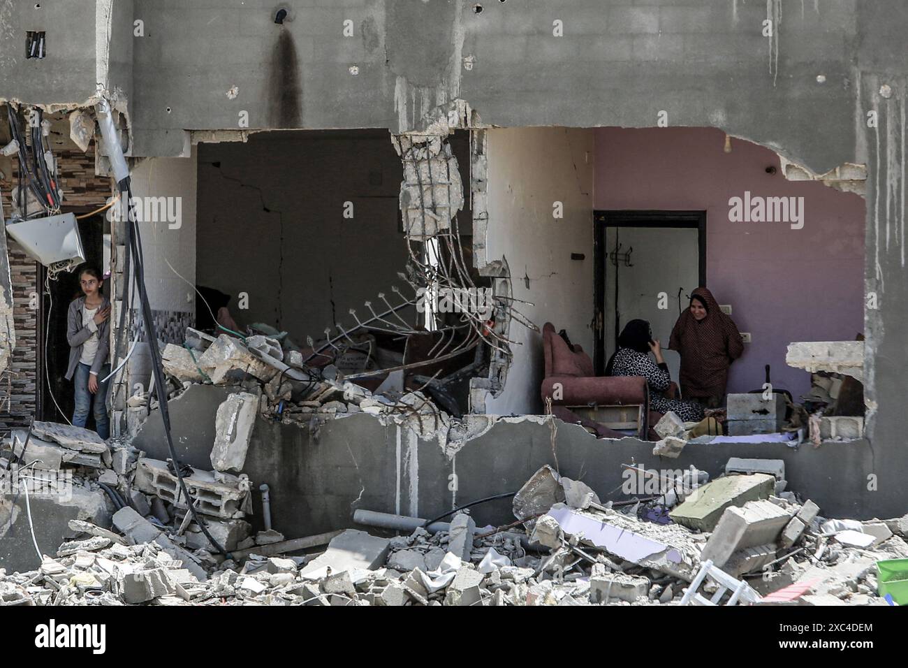 Khan Yunis, Palestinian Territories. 14th June, 2024. Palestinians sit ...