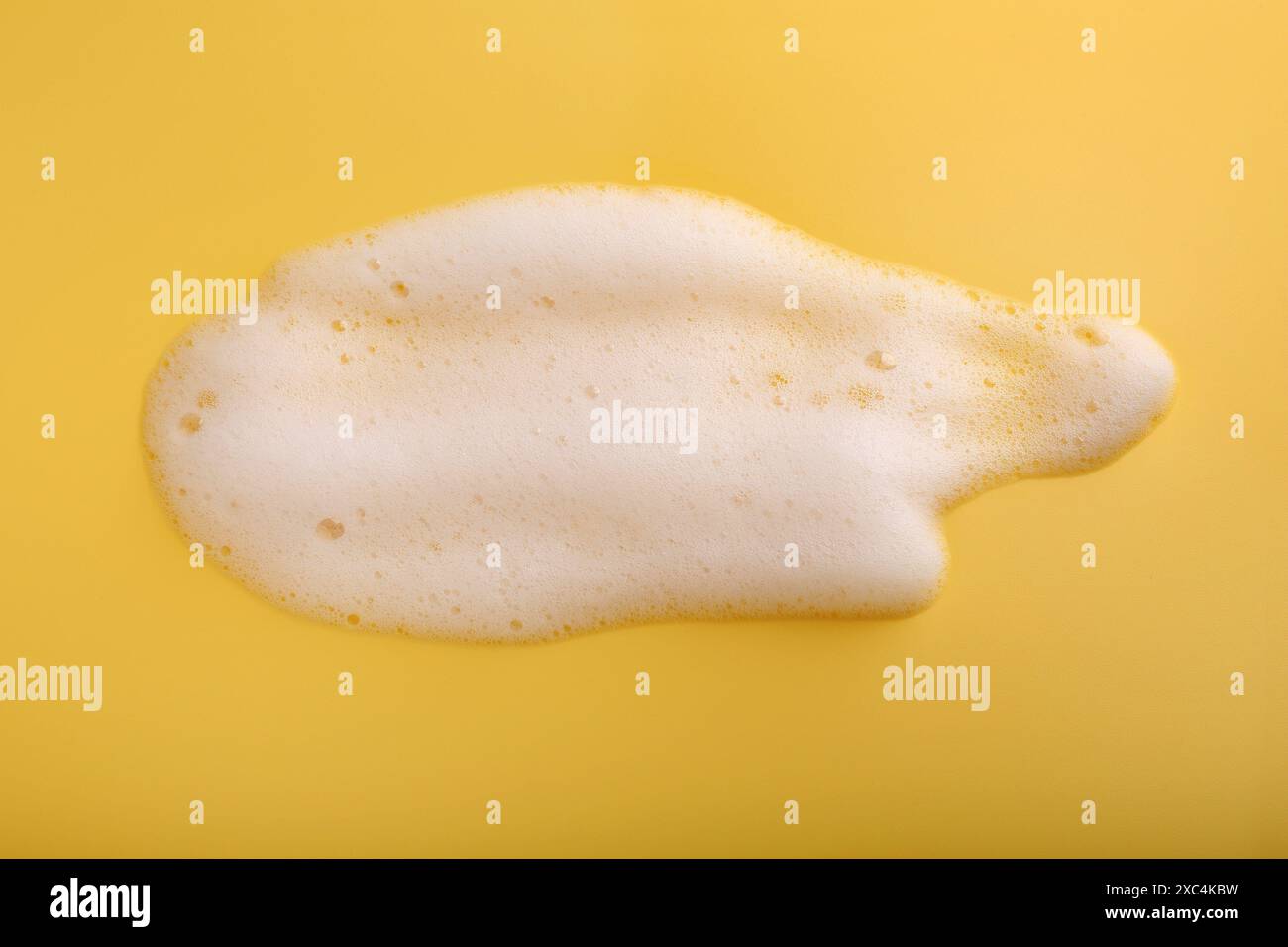 Sample of fluffy foam on yellow background, top view Stock Photo - Alamy