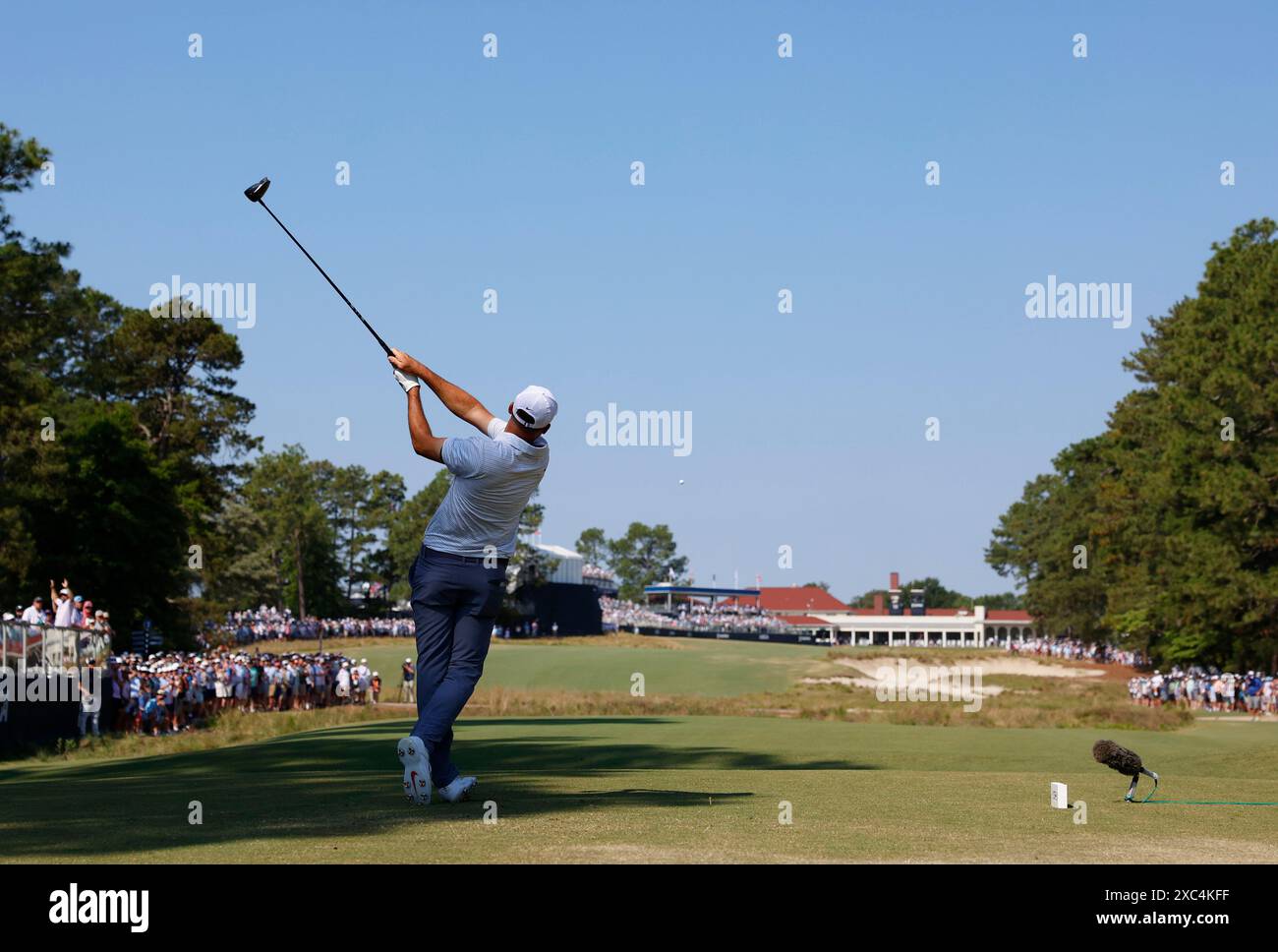 Scottie Scheffler hits his tee shot on the eighteenth hole during the ...