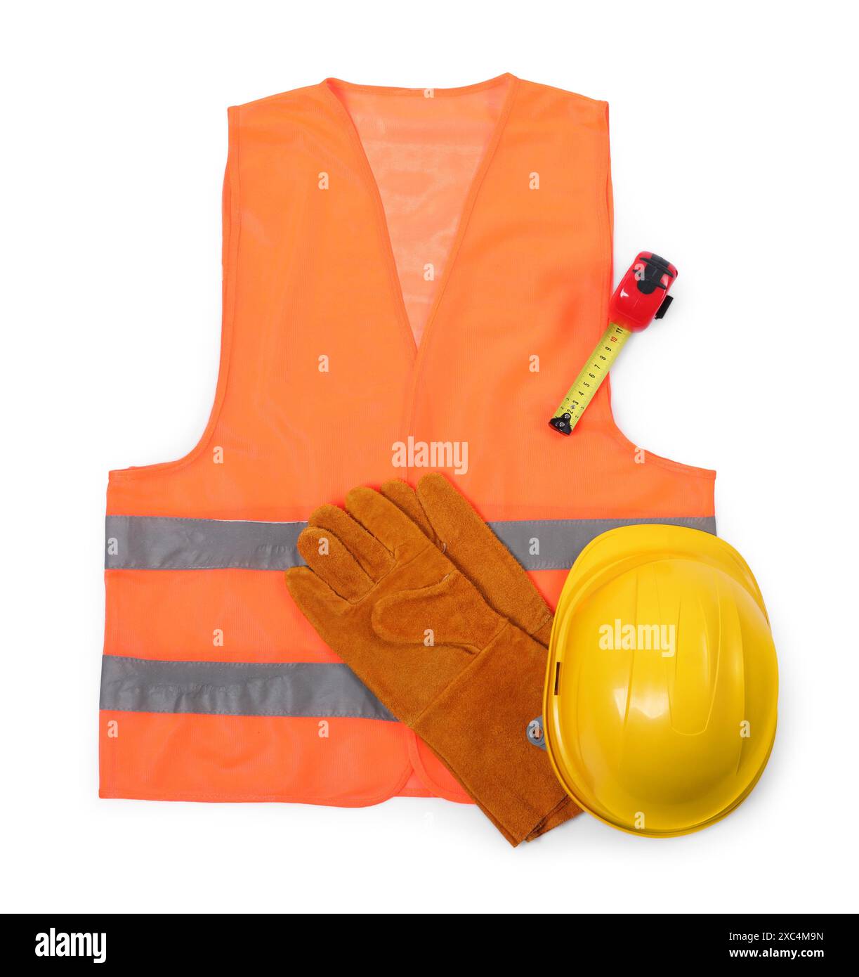 Orange reflective vest, hard hat, protective gloves and tape measure ...