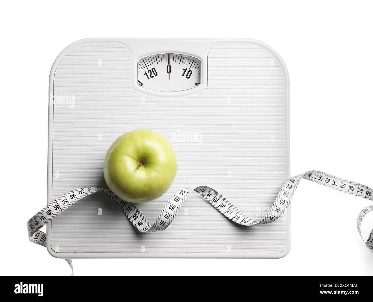 Scale, measuring tape and fresh apple isolated on white, top view Stock ...