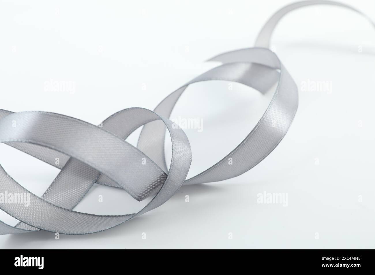 One beautiful gray ribbon isolated on white Stock Photo - Alamy