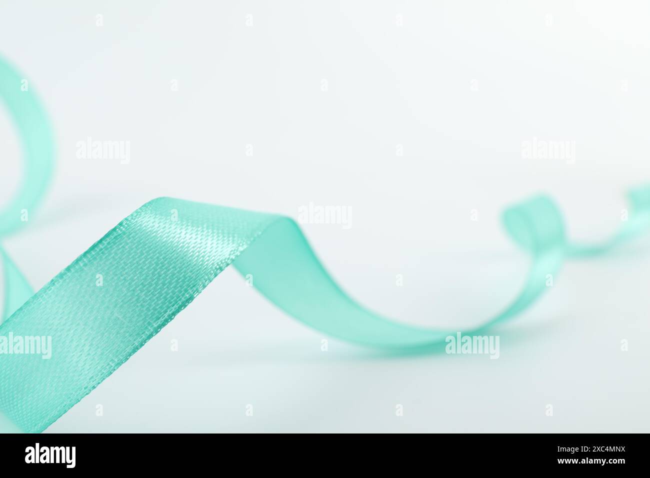 One beautiful turquoise ribbon isolated on white Stock Photo - Alamy