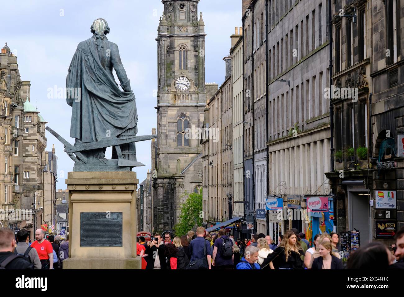 Royal Mile with the statue of Adam Smith and tourists.Edinburgh ...