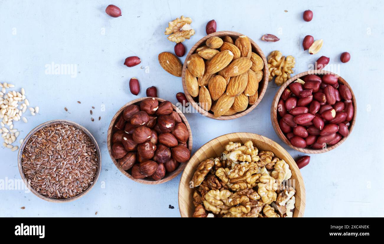 mixed nuts in bowls for healthy eating Stock Photo - Alamy
