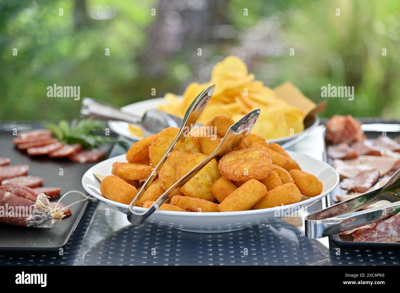 Food at the wedding pre-party buffet includes gourmet appetizers and ...