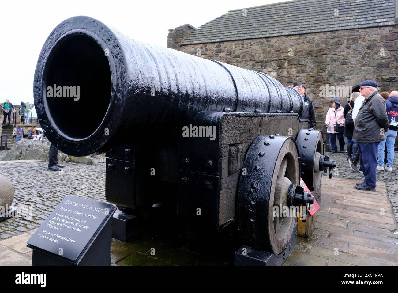 Visitors looking at the Mons Meg the largest medieval cannons in the ...