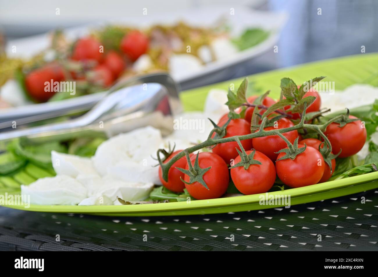 Close-up of a plate featuring fresh mozzarella and cherry tomatoes at ...