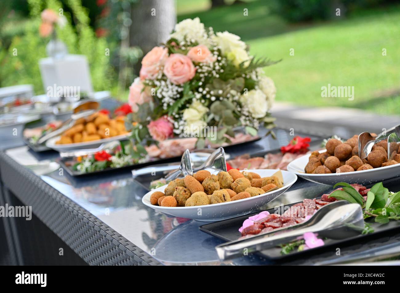 Food at the wedding pre-party buffet includes gourmet appetizers and ...