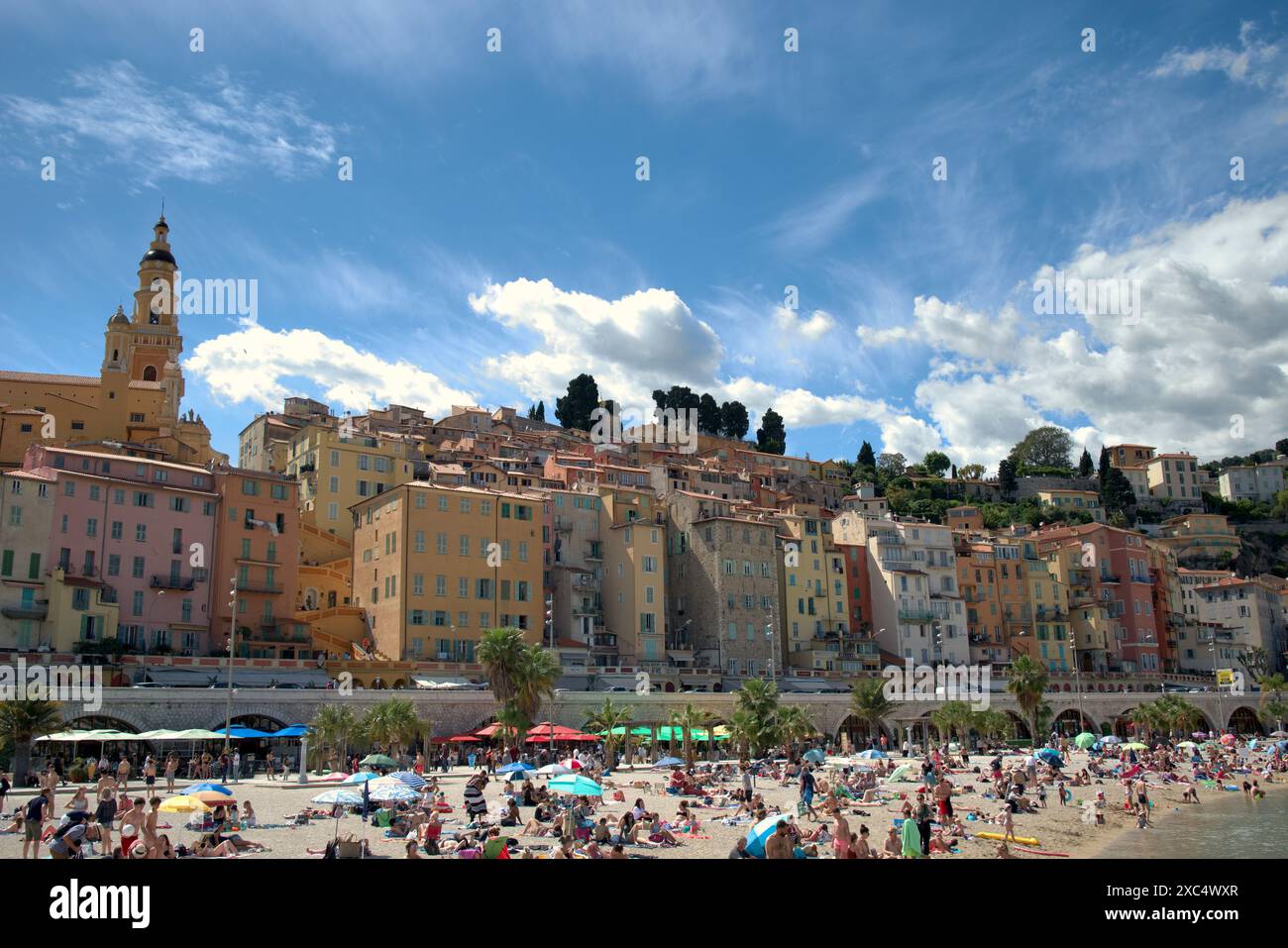 A picture of Menton colorful city from the port, zith the beach in the ...