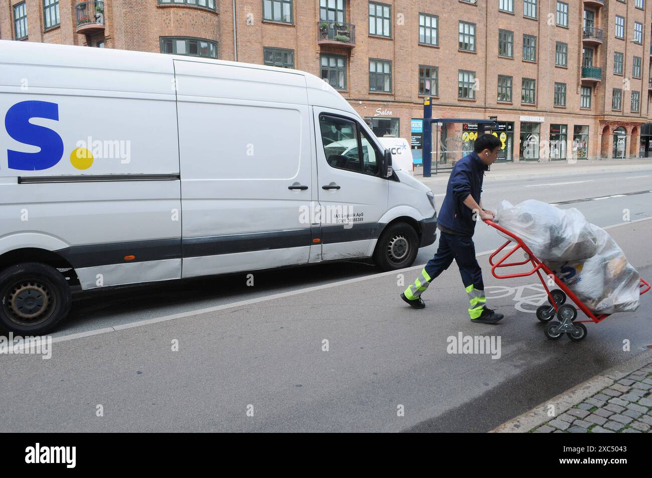 Copenhagen/ Denmark/14 JUNE 2024/GLS delivery male in action and gls ...