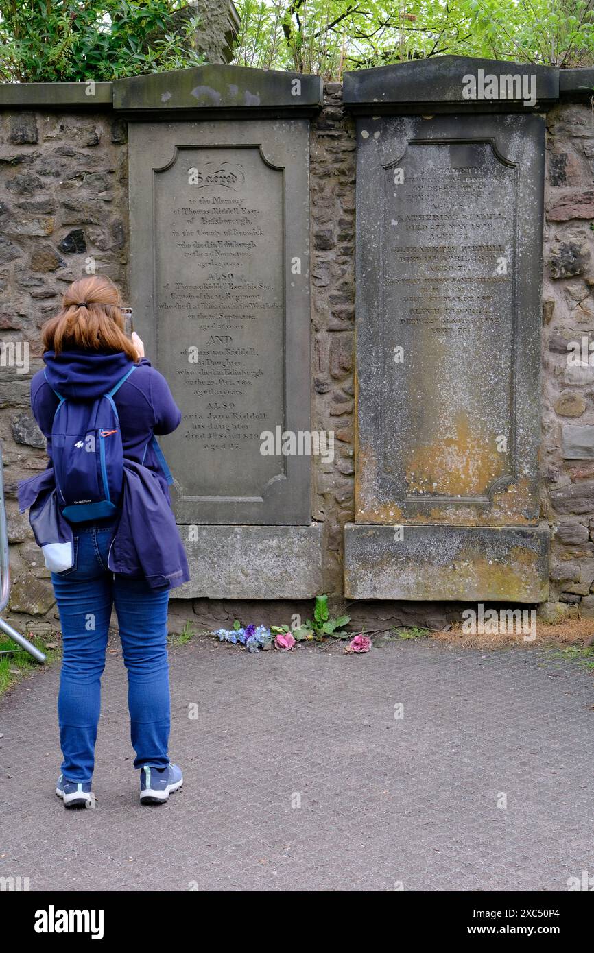 A visitor taking photo of the tombstone of Tom Marvolo Riddle (above ...