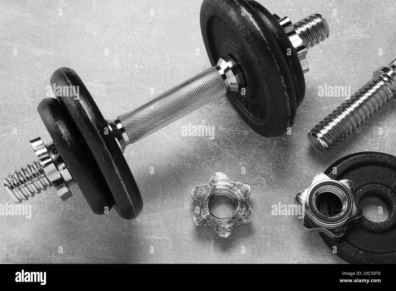 Barbell and parts of one on grey textured background, flat lay Stock ...