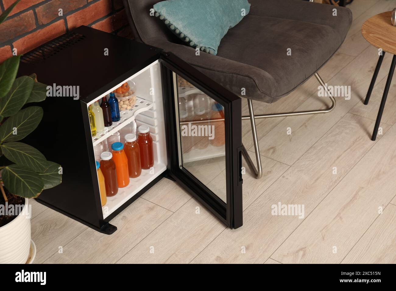 Mini refrigerator with drinks and snacks indoors Stock Photo - Alamy