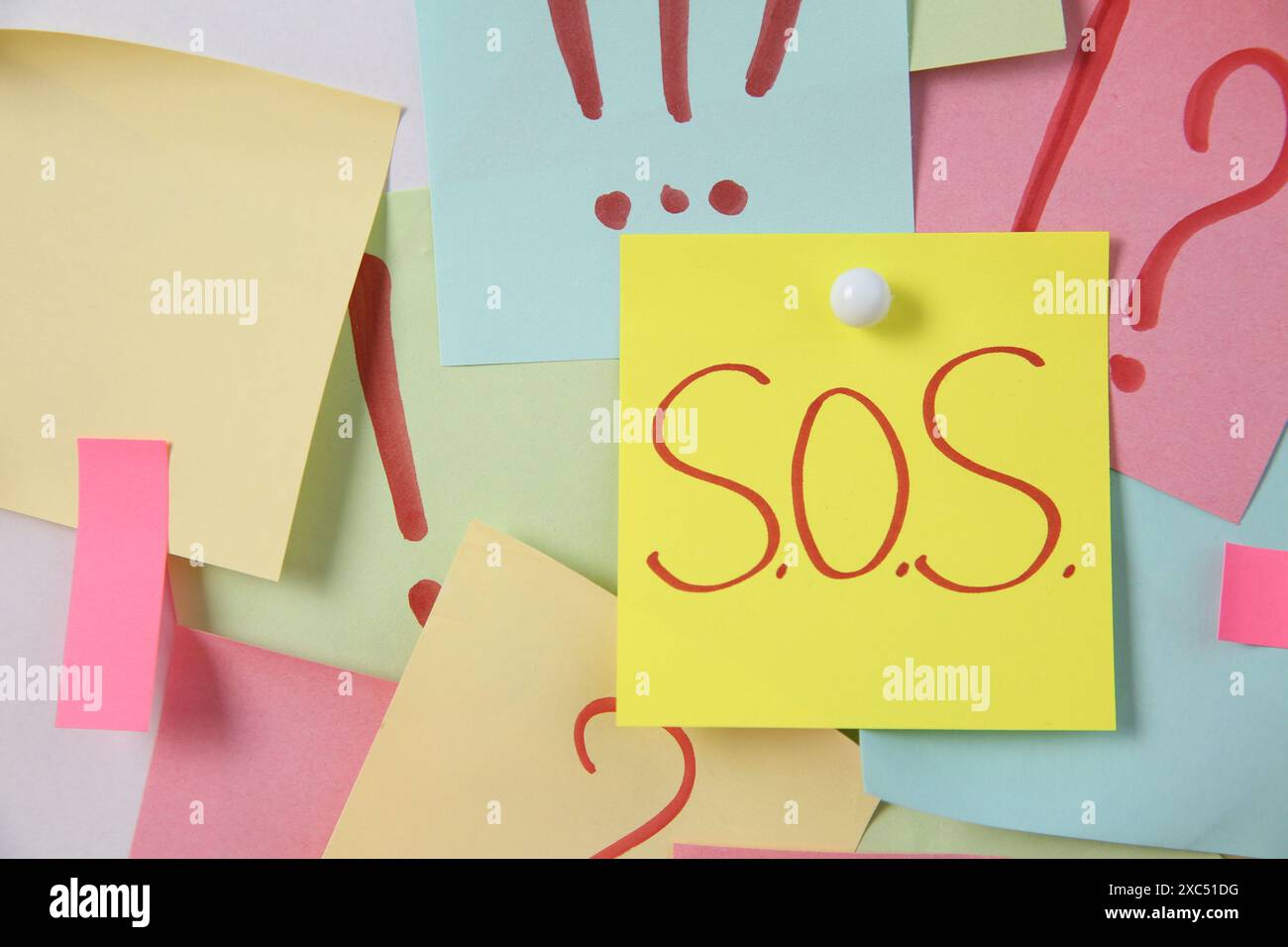 Notes with word SOS and symbols on board, closeup Stock Photo - Alamy